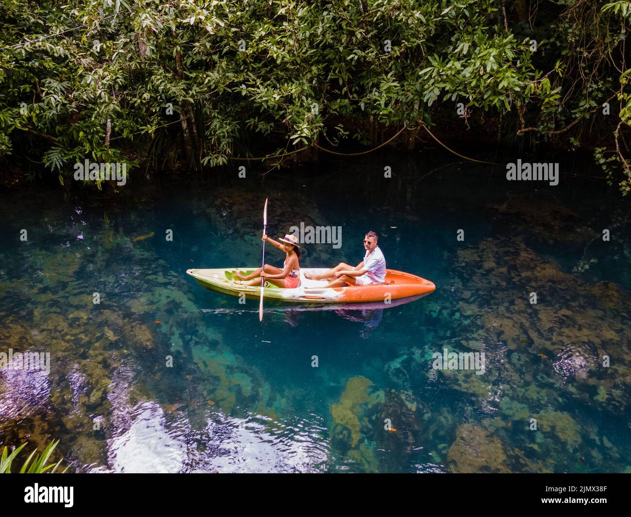 Couple in kayak in the jungle of Krabi Thailand, men and woman in kayak ...