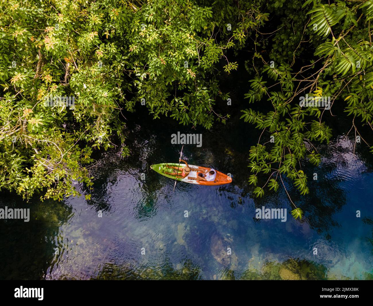 Couple in kayak in the jungle of Krabi Thailand, men and woman in kayak ...