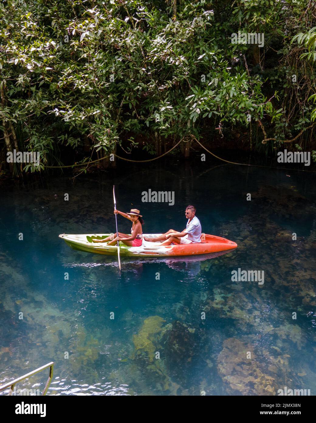 Couple in kayak in the jungle of Krabi Thailand, men and woman in kayak ...