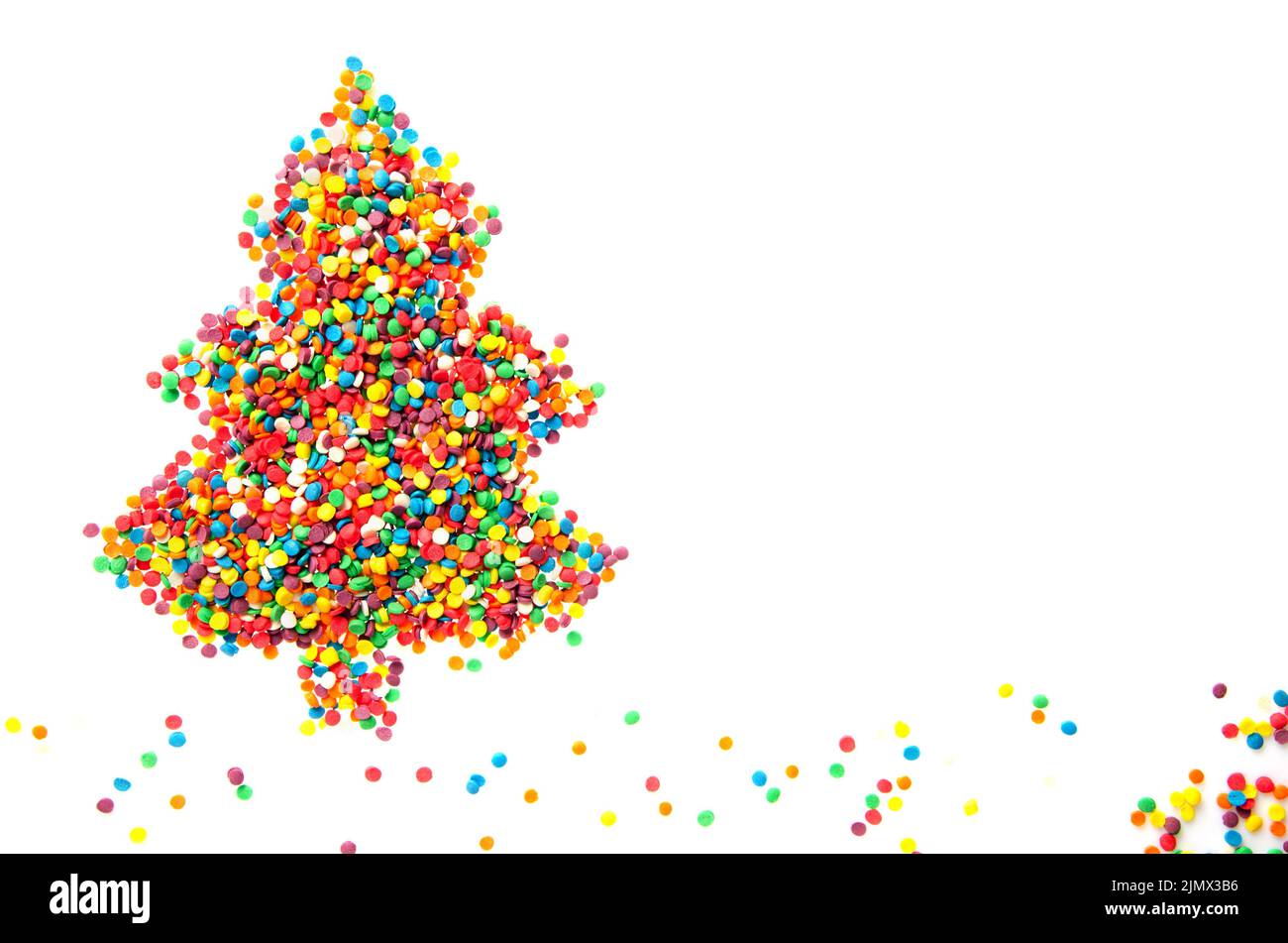 Christmas tree made of sugar sprinkles on white background Stock Photo ...