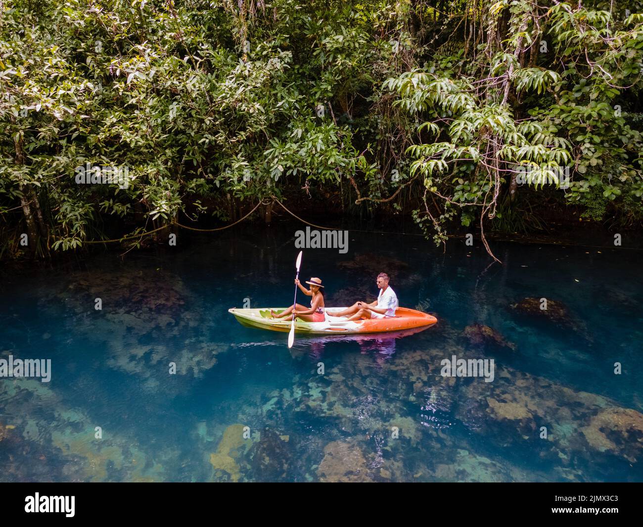 Couple in kayak in the jungle of Krabi Thailand, men and woman in kayak ...