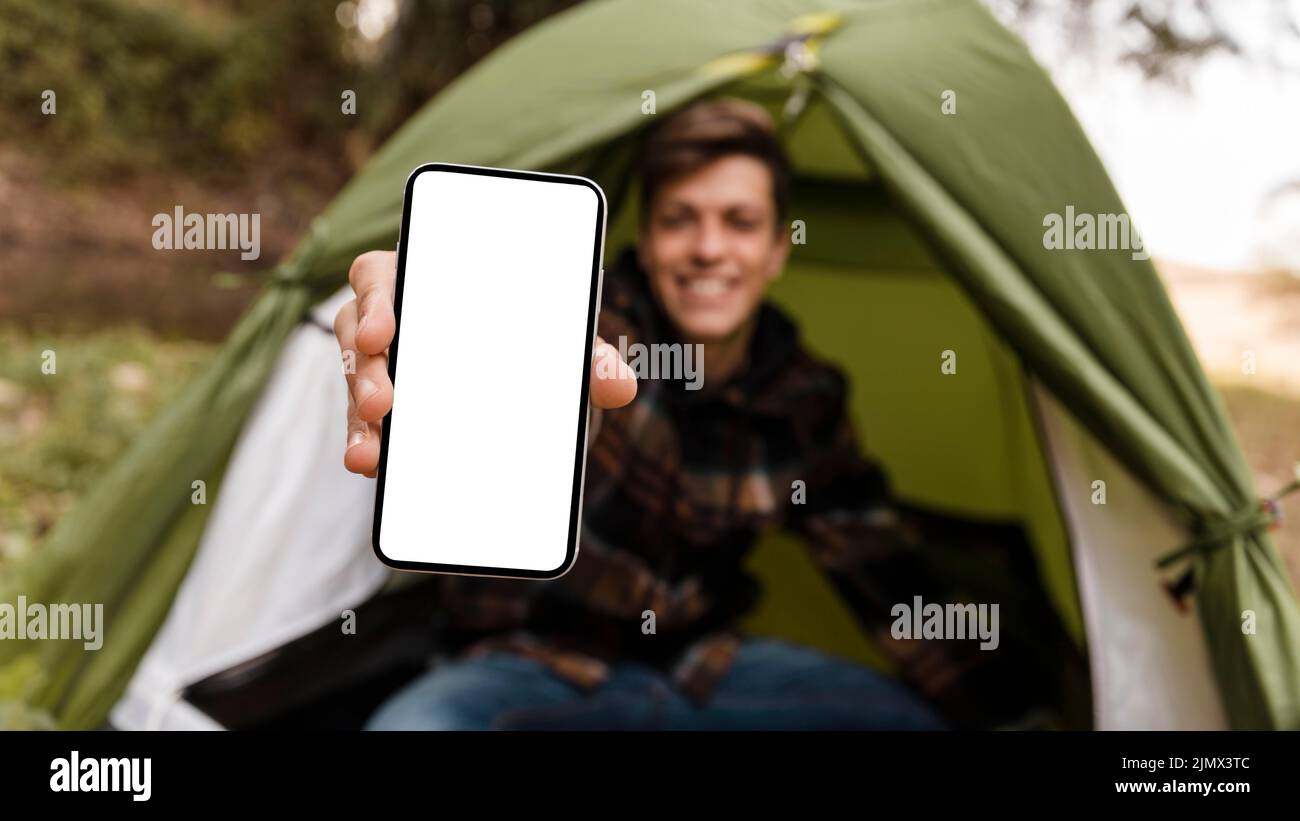 Happy camping man forest copy space mobile phone Stock Photo - Alamy