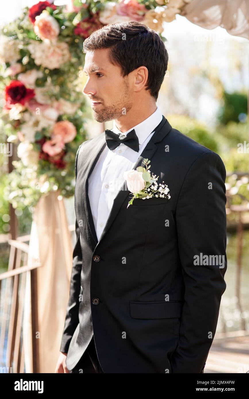 His eyes are only set on his bride. a handsome young man standing by ...