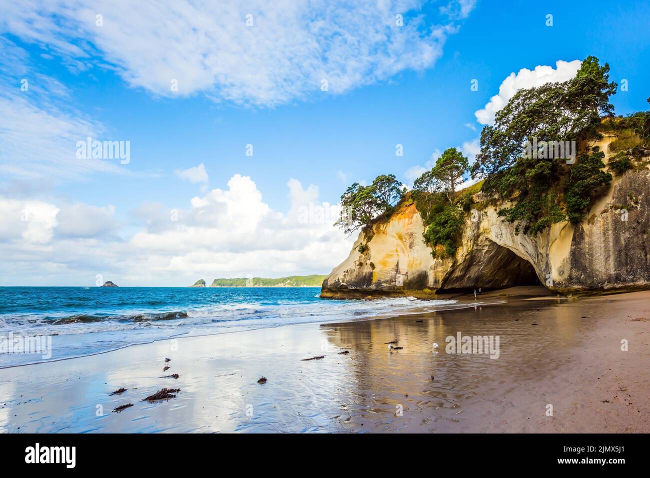 Sunset on small beach Stock Photo - Alamy