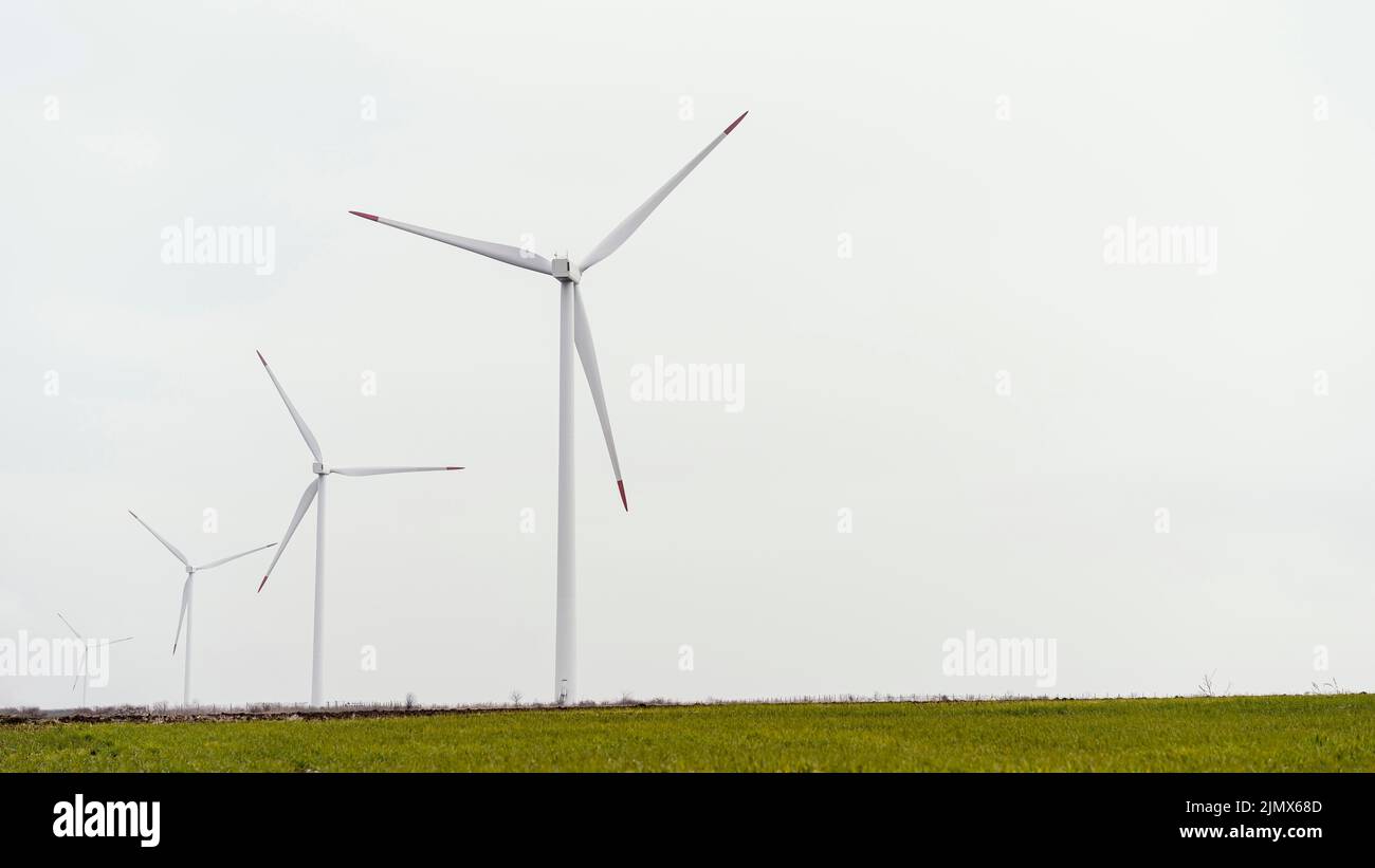 Front view wind turbines with copy space Stock Photo - Alamy
