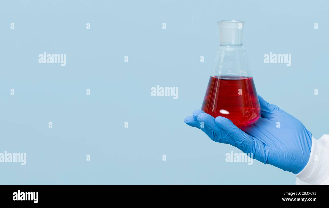 Front view scientist holding red chemical with copy space Stock Photo ...