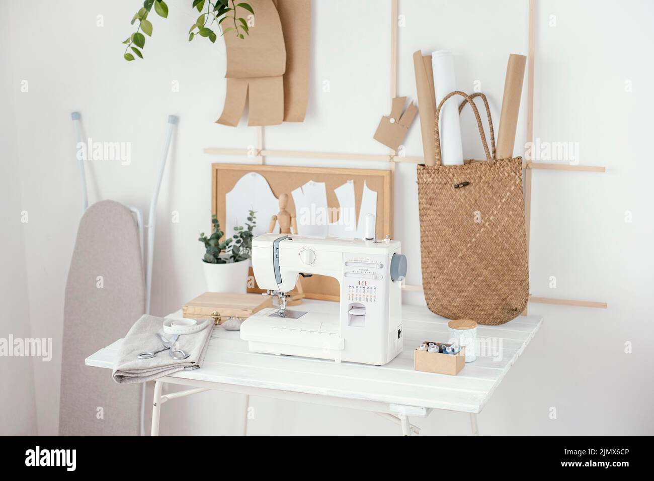 Front view tailoring studio with sewing machine table Stock Photo - Alamy