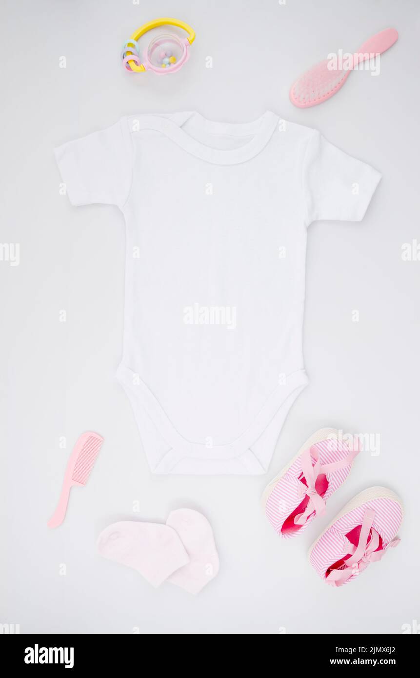 Flat lay baby clothes with white background Stock Photo - Alamy