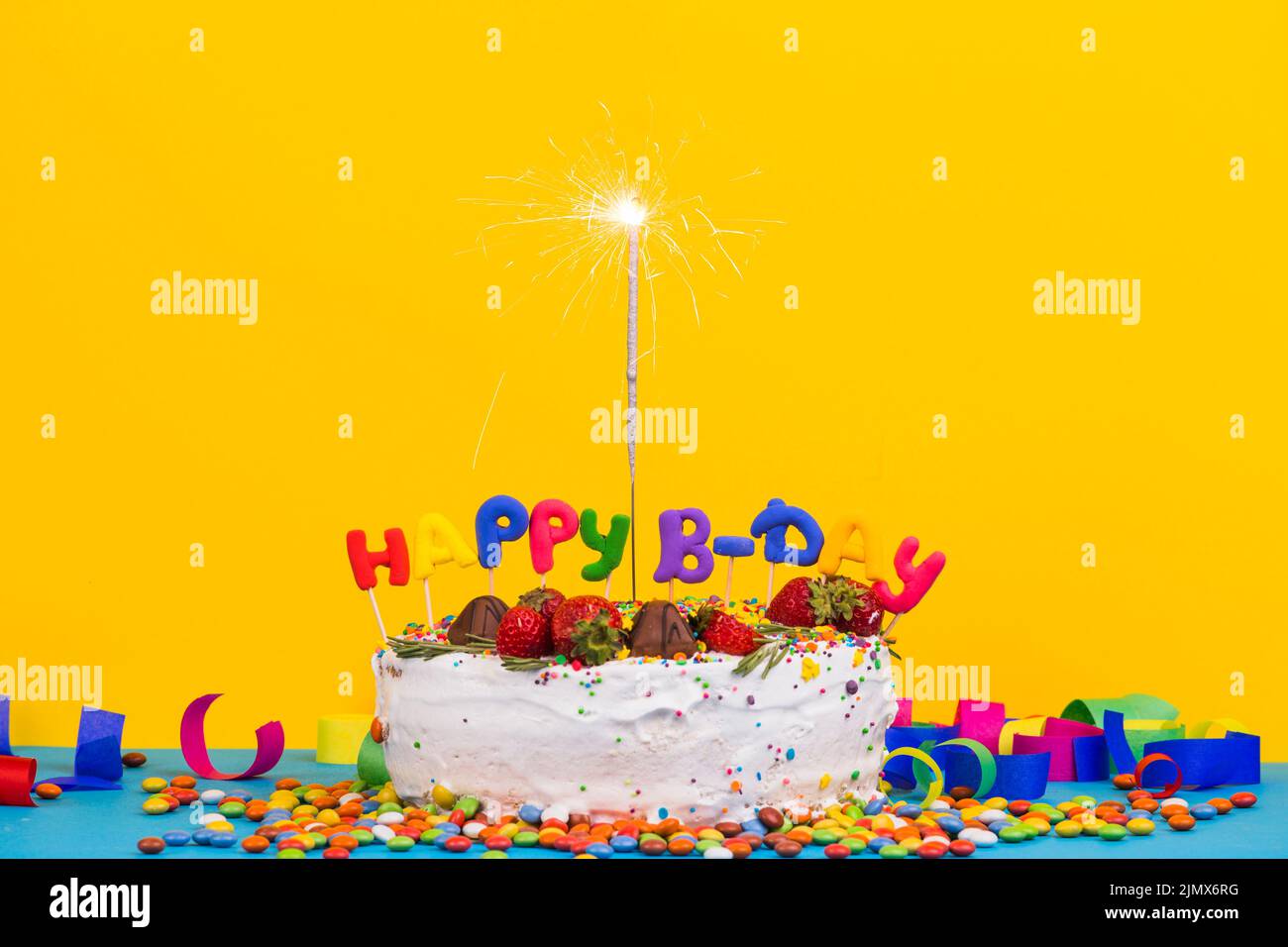 Front view birthday cake with sparkler Stock Photo - Alamy