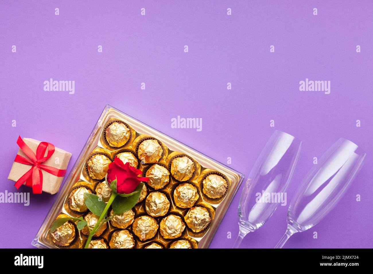 Flat lay frame with chocolate box gift Stock Photo - Alamy