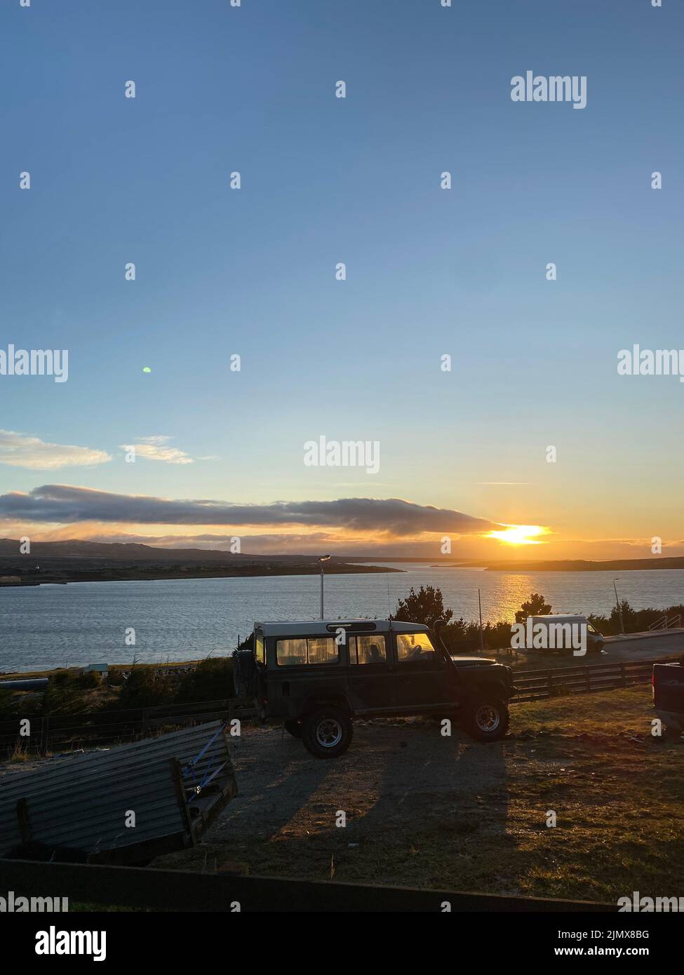 Stanley, UK. 15th June, 2022. The sun sets behind a Land Rover ...