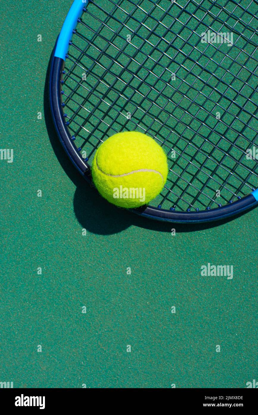 Tennis racquet and ball lying on the court. Healthy lifestyle concept ...
