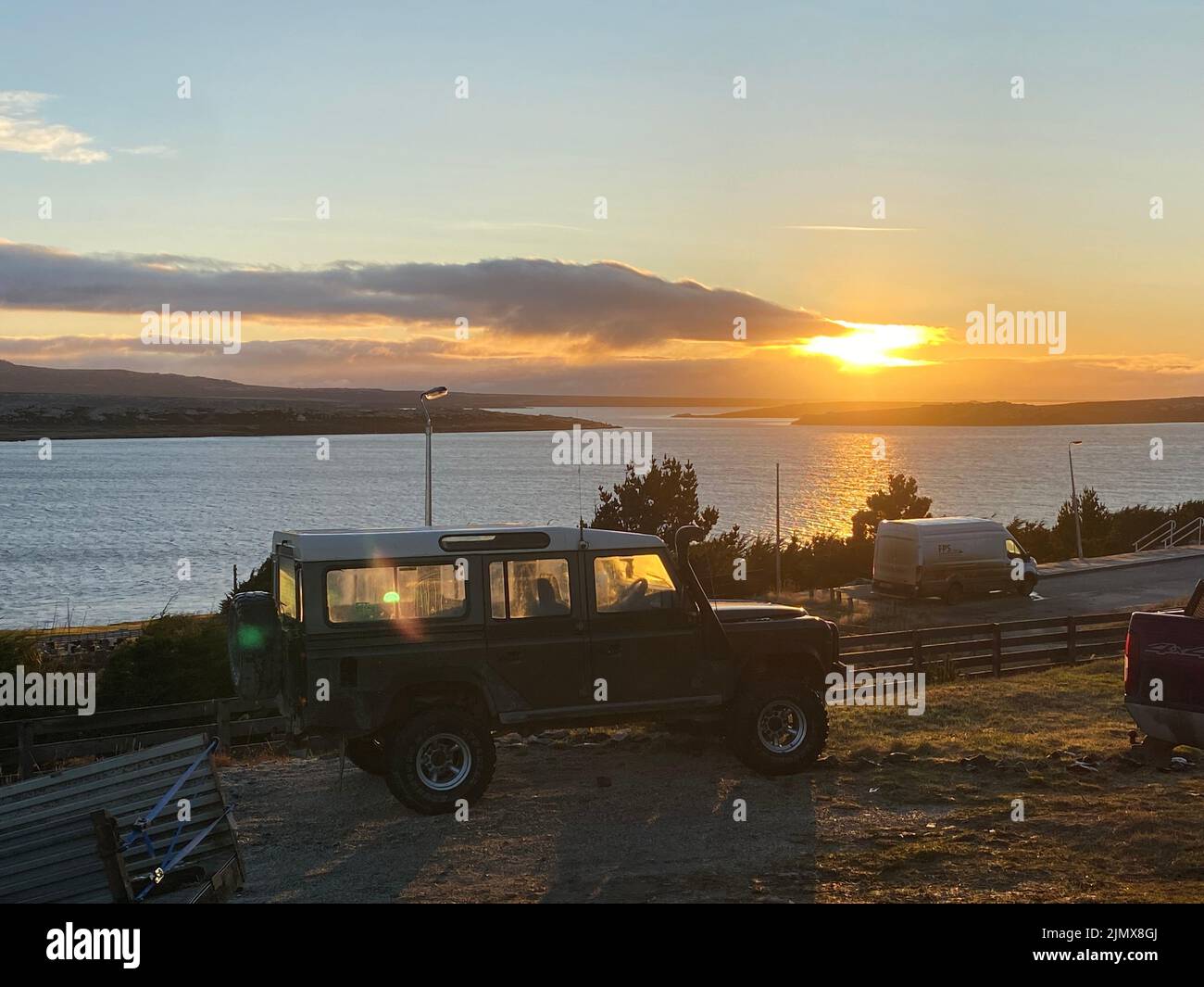Stanley, UK. 15th June, 2022. The sun sets behind a Land Rover ...