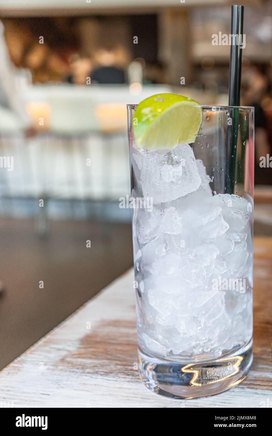 Slice of Lime on a glass full of frozen ice Stock Photo - Alamy