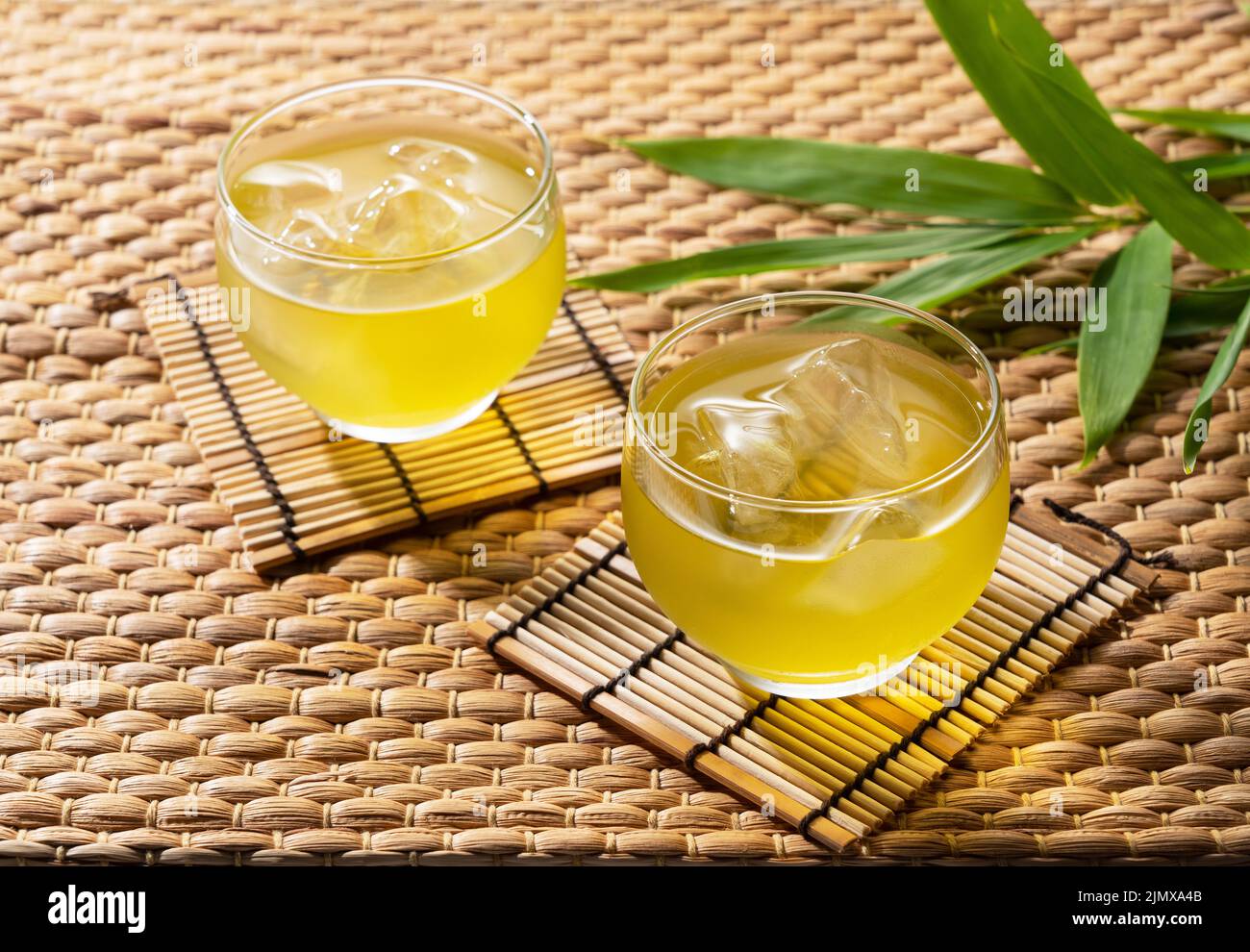 Cold Japanese green tea placed on a straw ranchon mat Stock Photo - Alamy