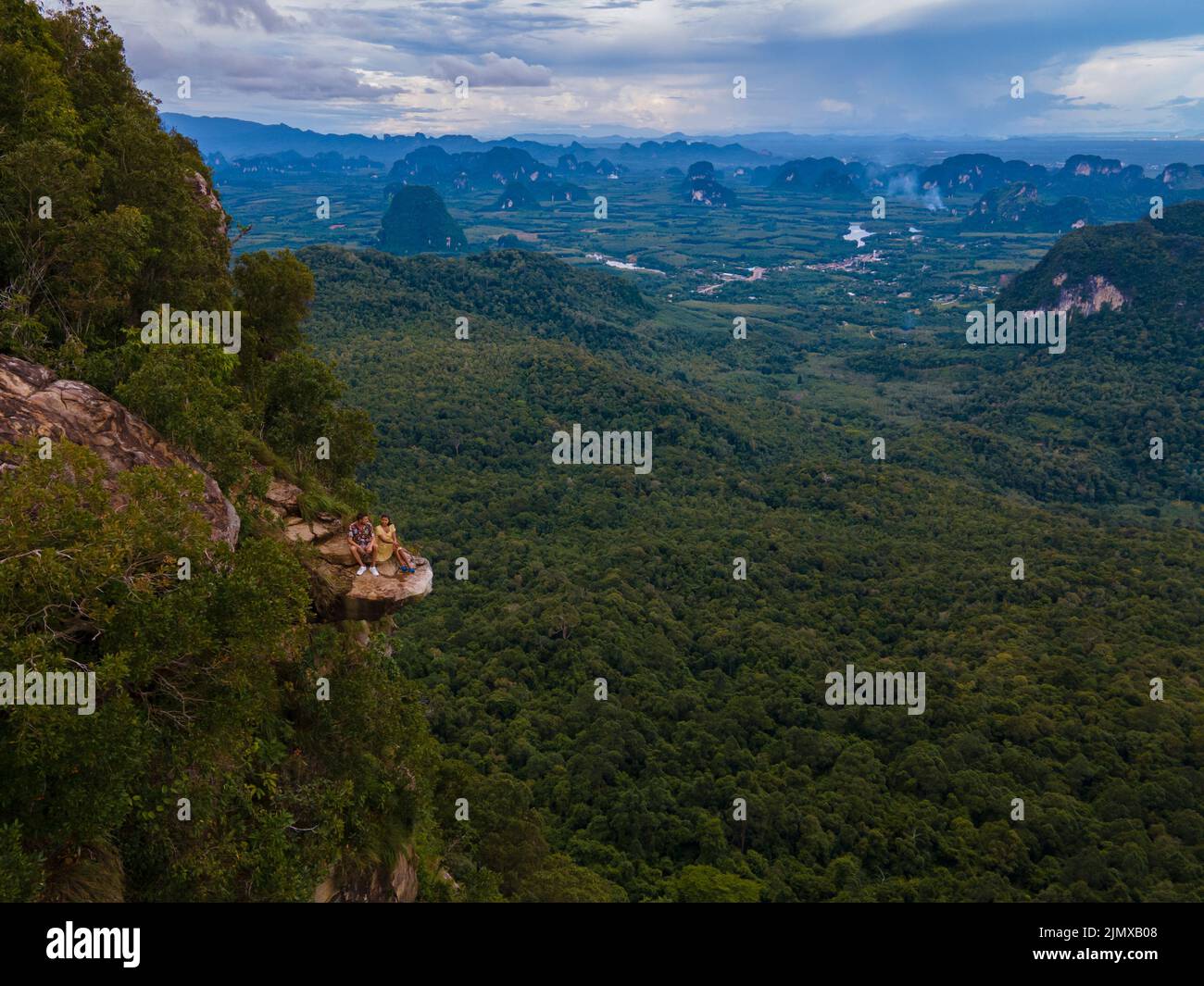 Dragon Crest mountain Krabi Thailand, a Young traveler sits on a rock ...