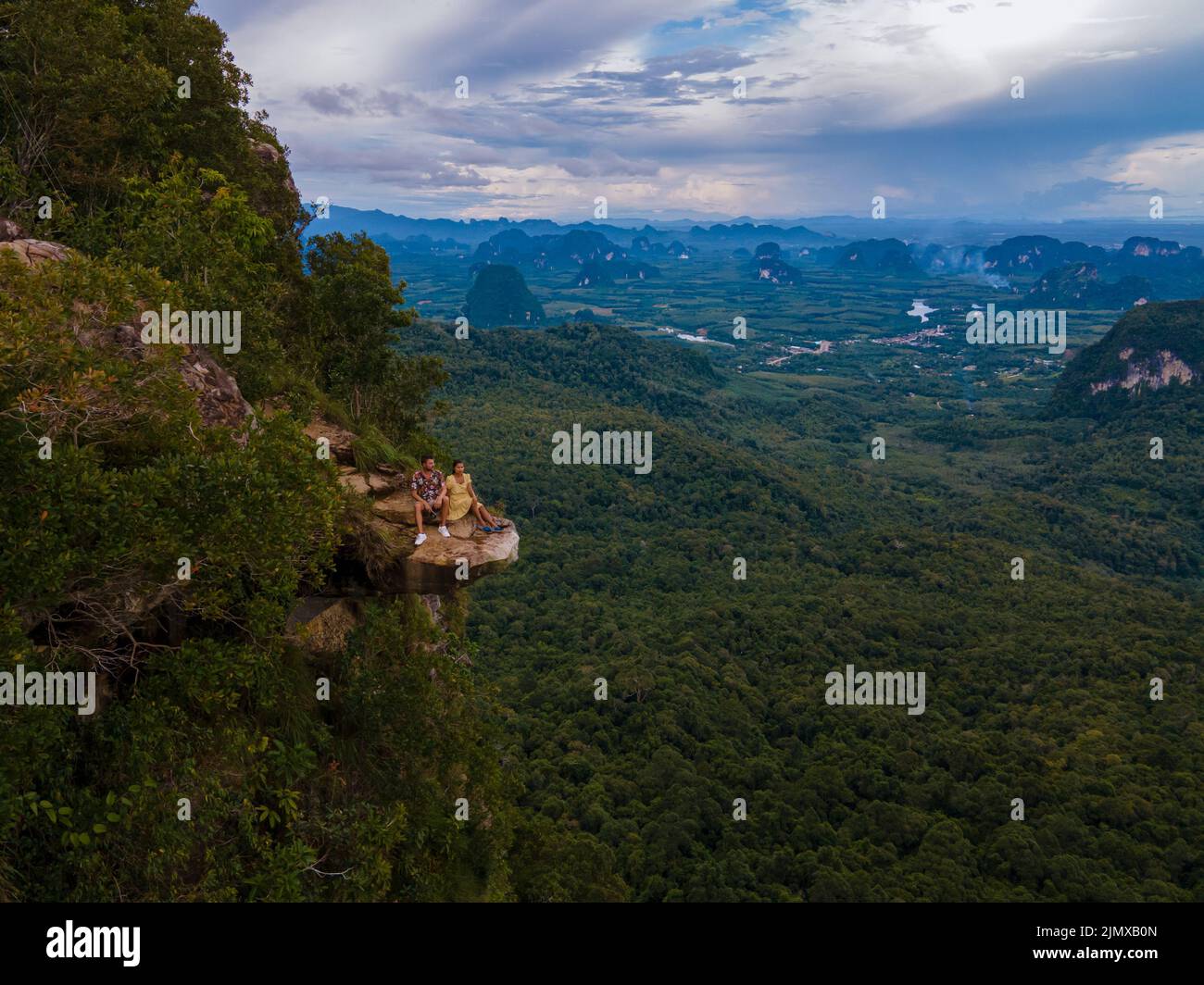 Dragon Crest mountain Krabi Thailand, a Young traveler sits on a rock ...