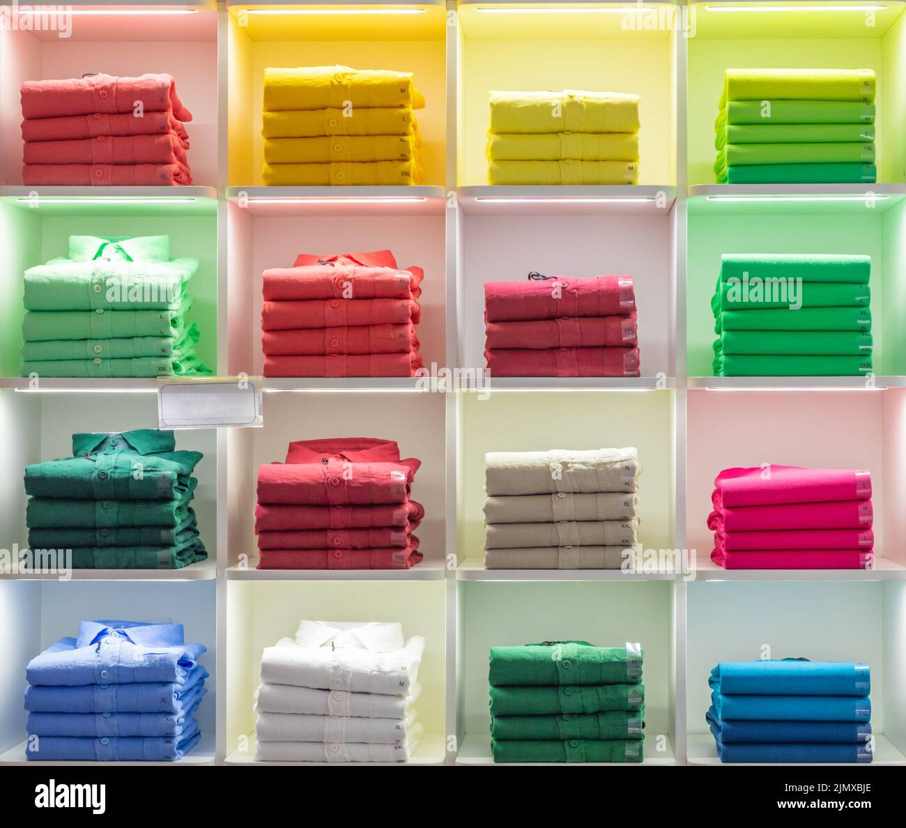 Polo t-shirt store interior. Shop shelves with colored fashion cotton ...