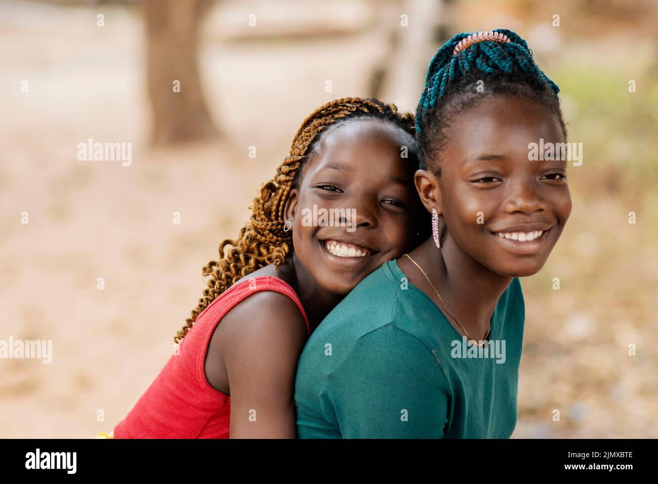 Close up smiley african girls outdoors Stock Photo - Alamy