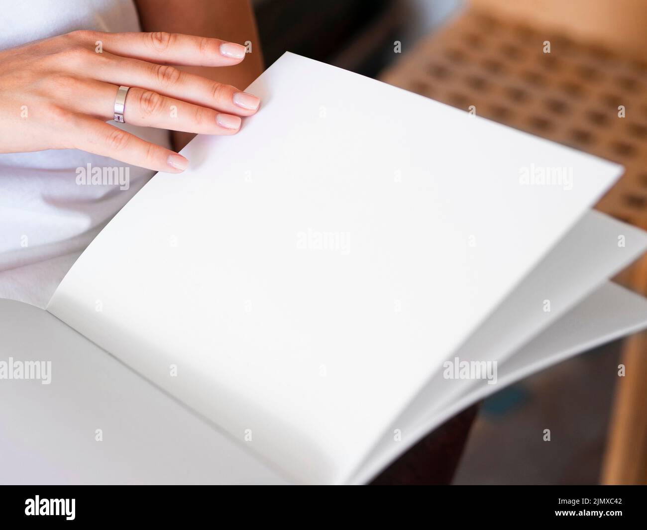 Close up woman reading mock up magazine Stock Photo - Alamy