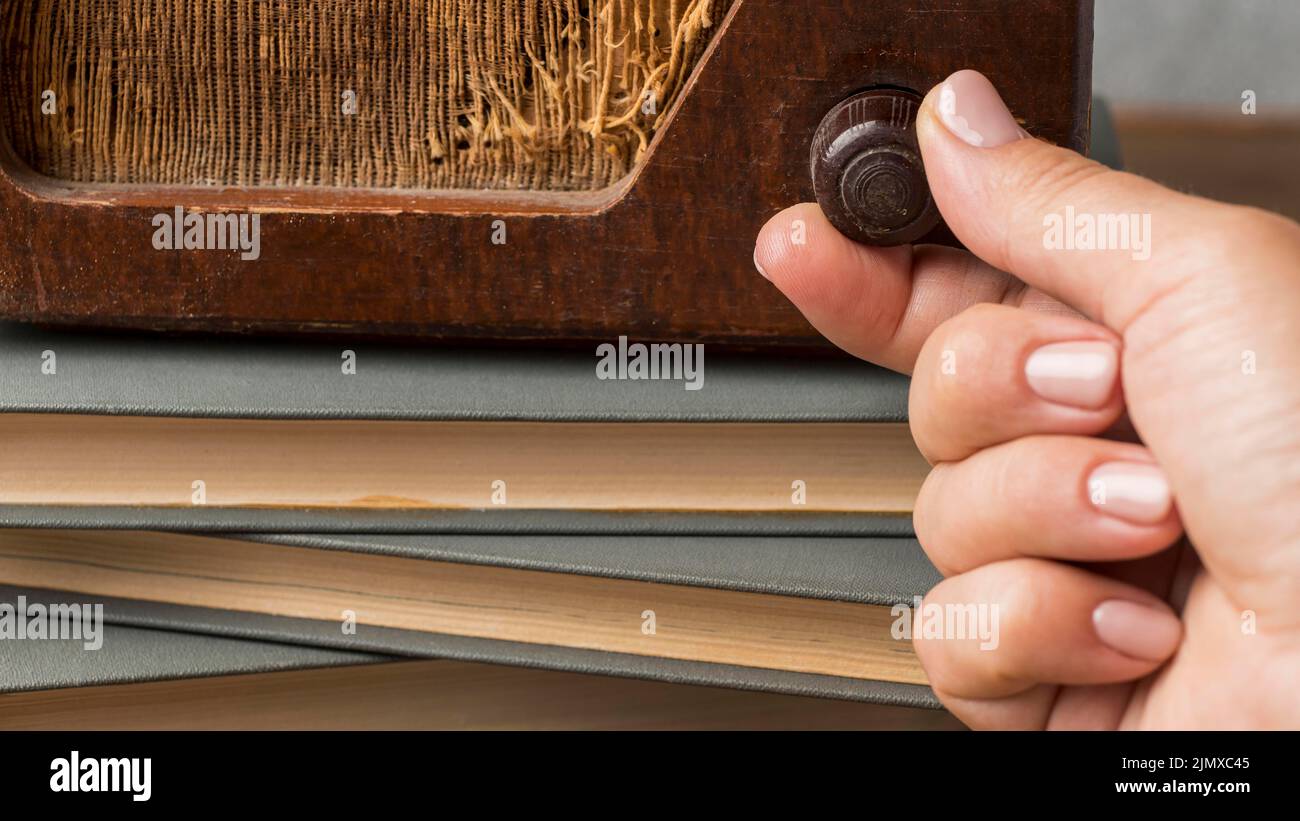 Close up person using vintage radio button Stock Photo - Alamy