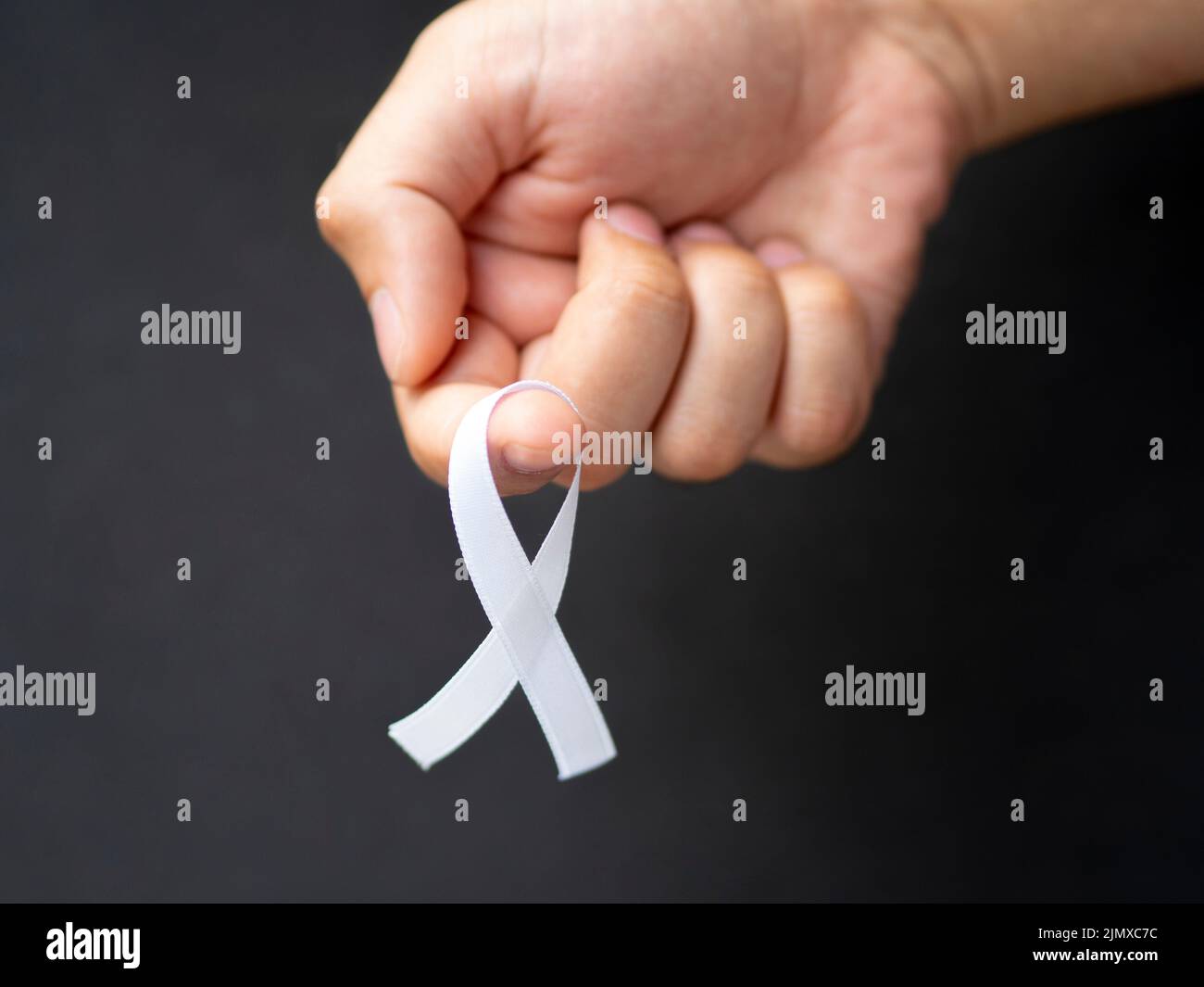 Holding ribbon hi-res stock photography and images - Alamy