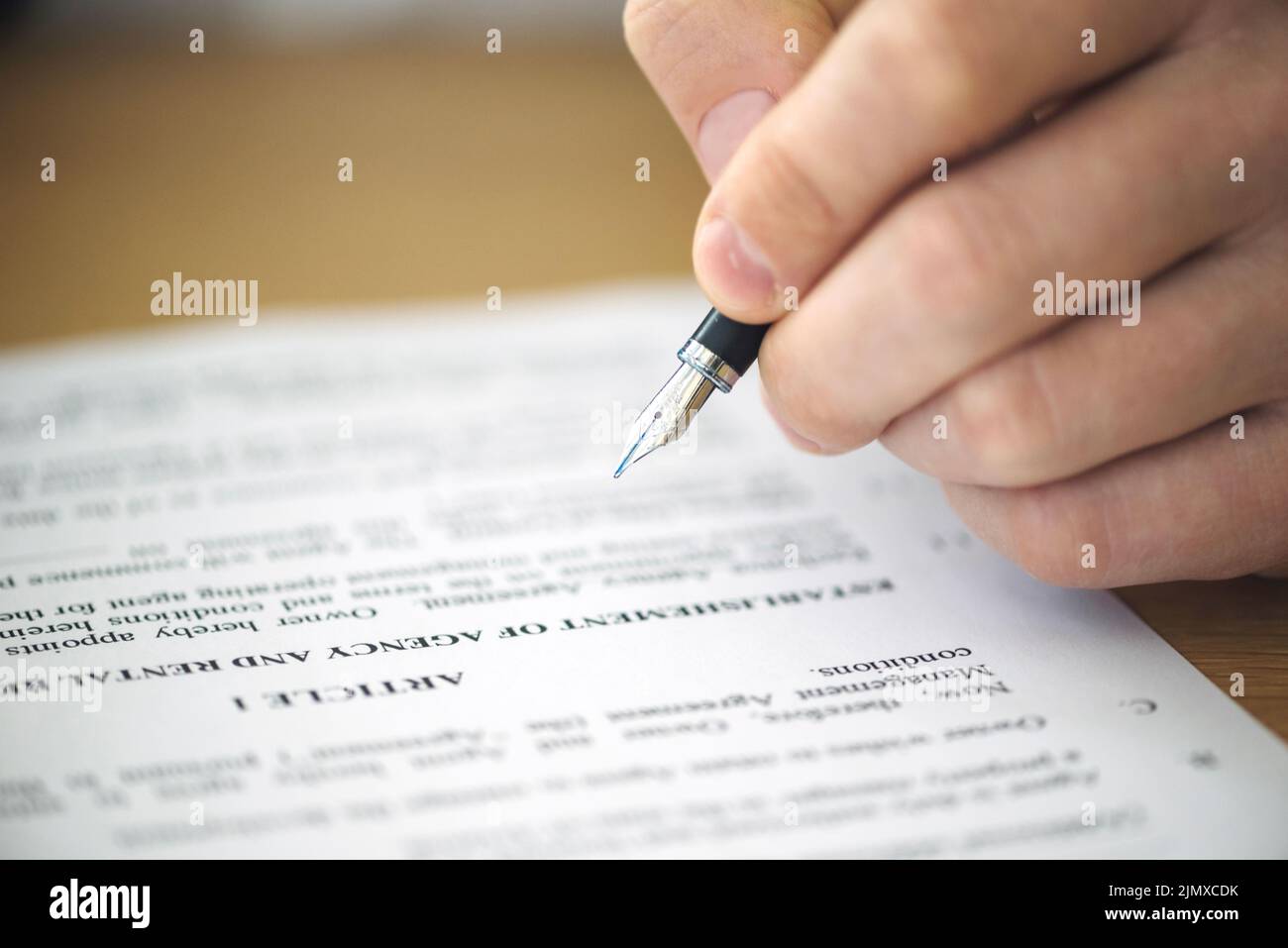 Close up hand signing document hi-res stock photography and images - Alamy