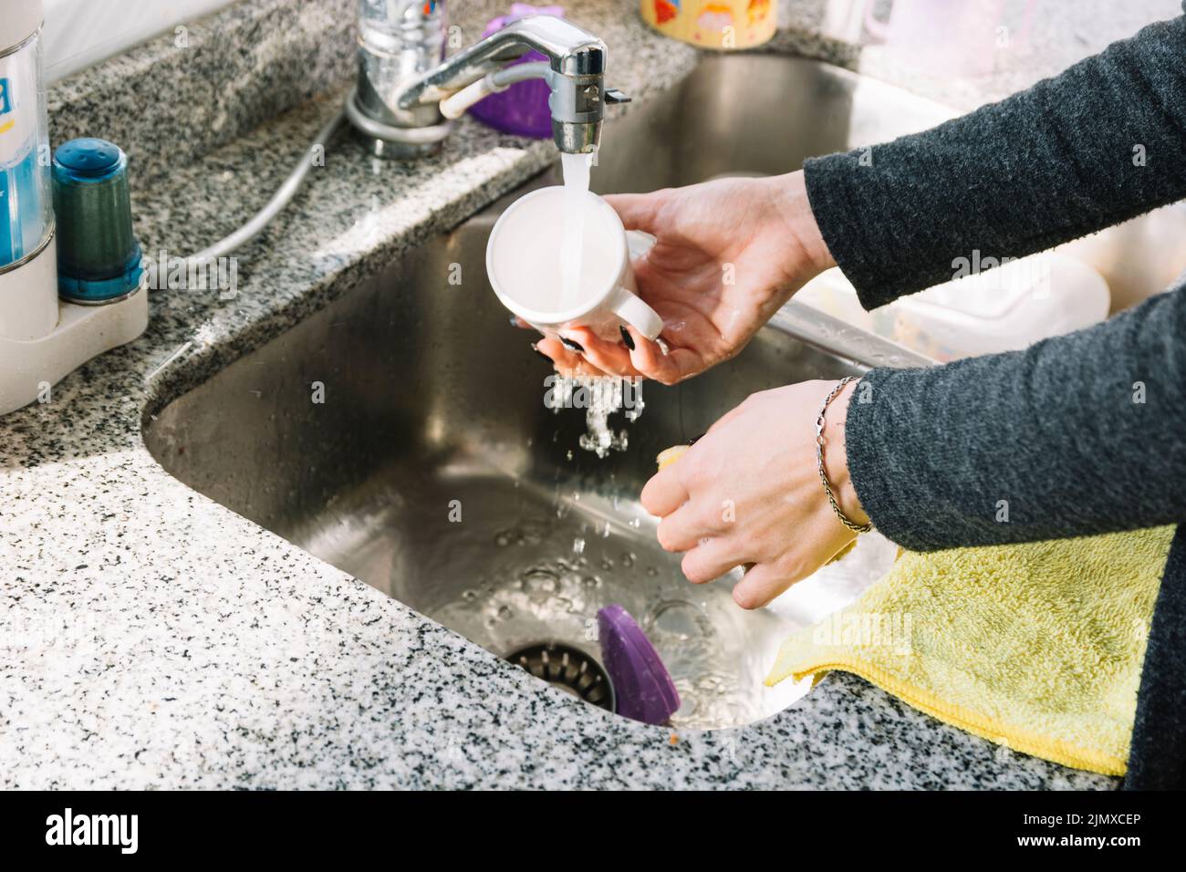Close up woman s hand washing cup kitchen sink Stock Photo - Alamy
