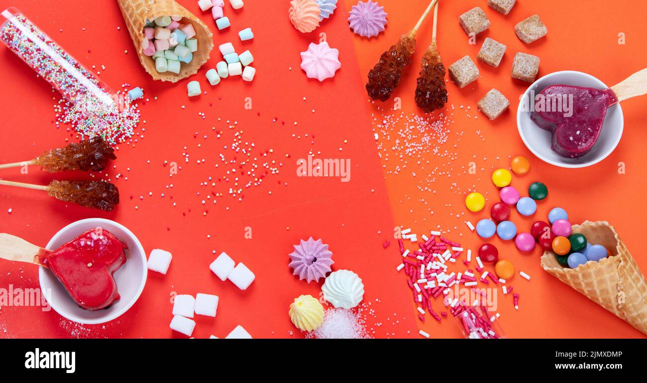 Mix of sweets and candy with sugar spread and written text in unhealthy ...