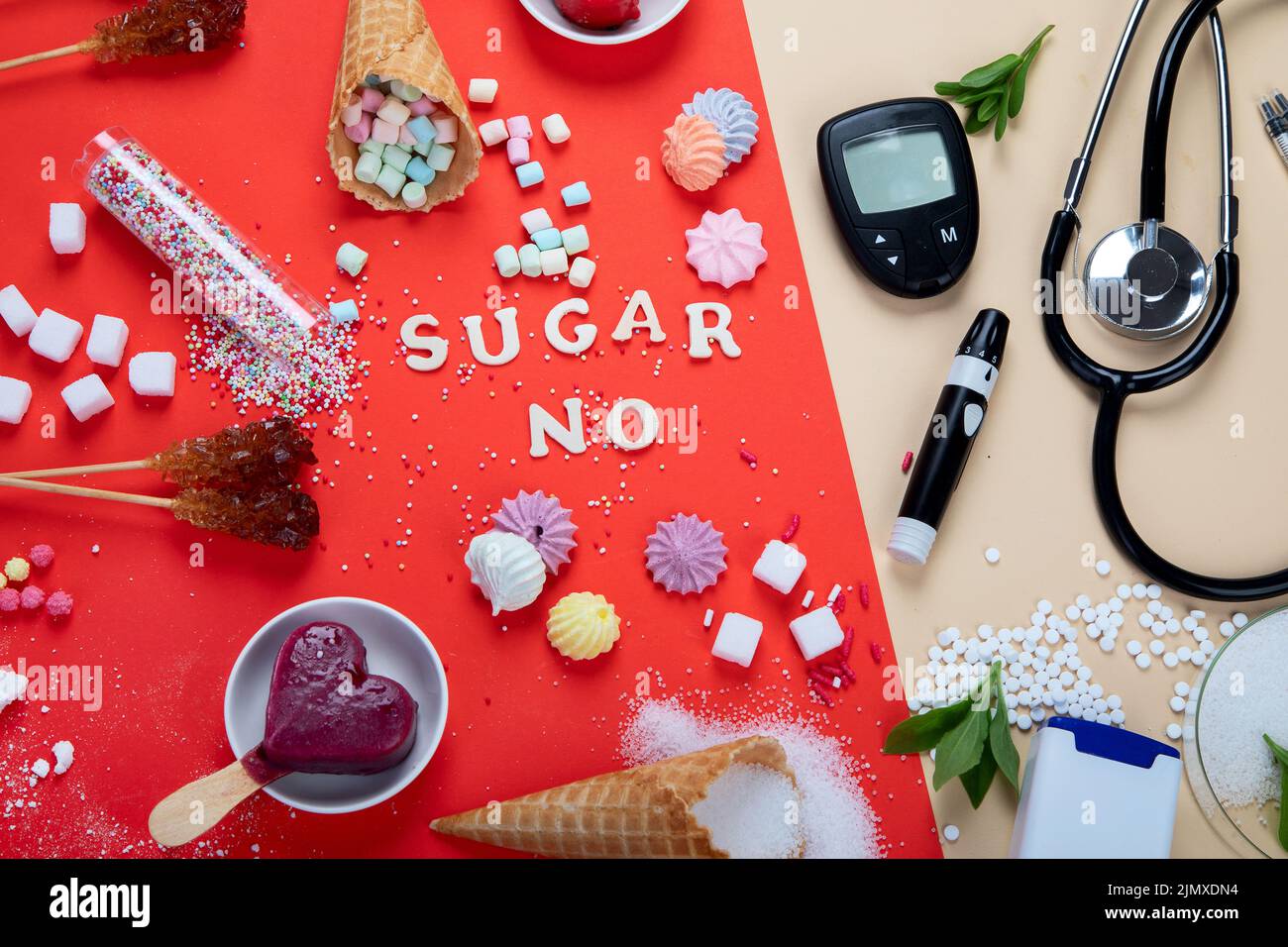 Mix of sweets and candy with sugar spread and written text in unhealthy ...