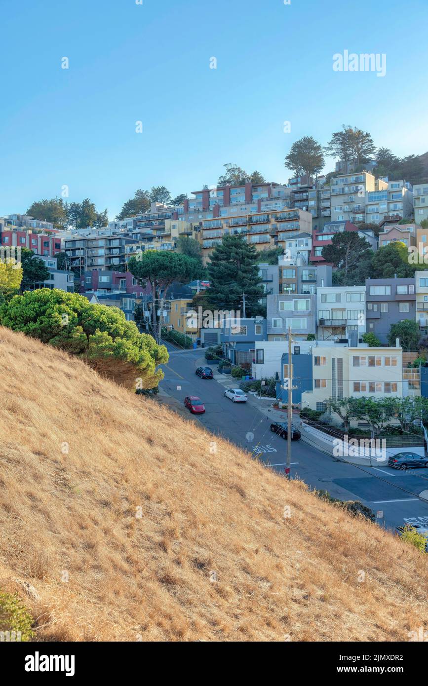 View of a street in a residential area from a slope in Kate Hill Park ...