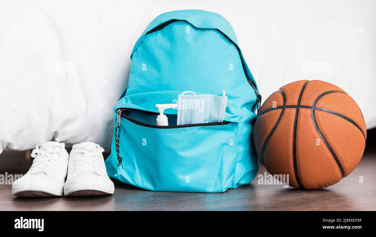 Back school arrangement with blue backpack Stock Photo - Alamy