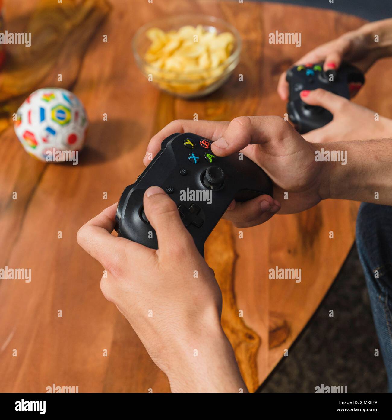 Boys playing with console Stock Photo - Alamy