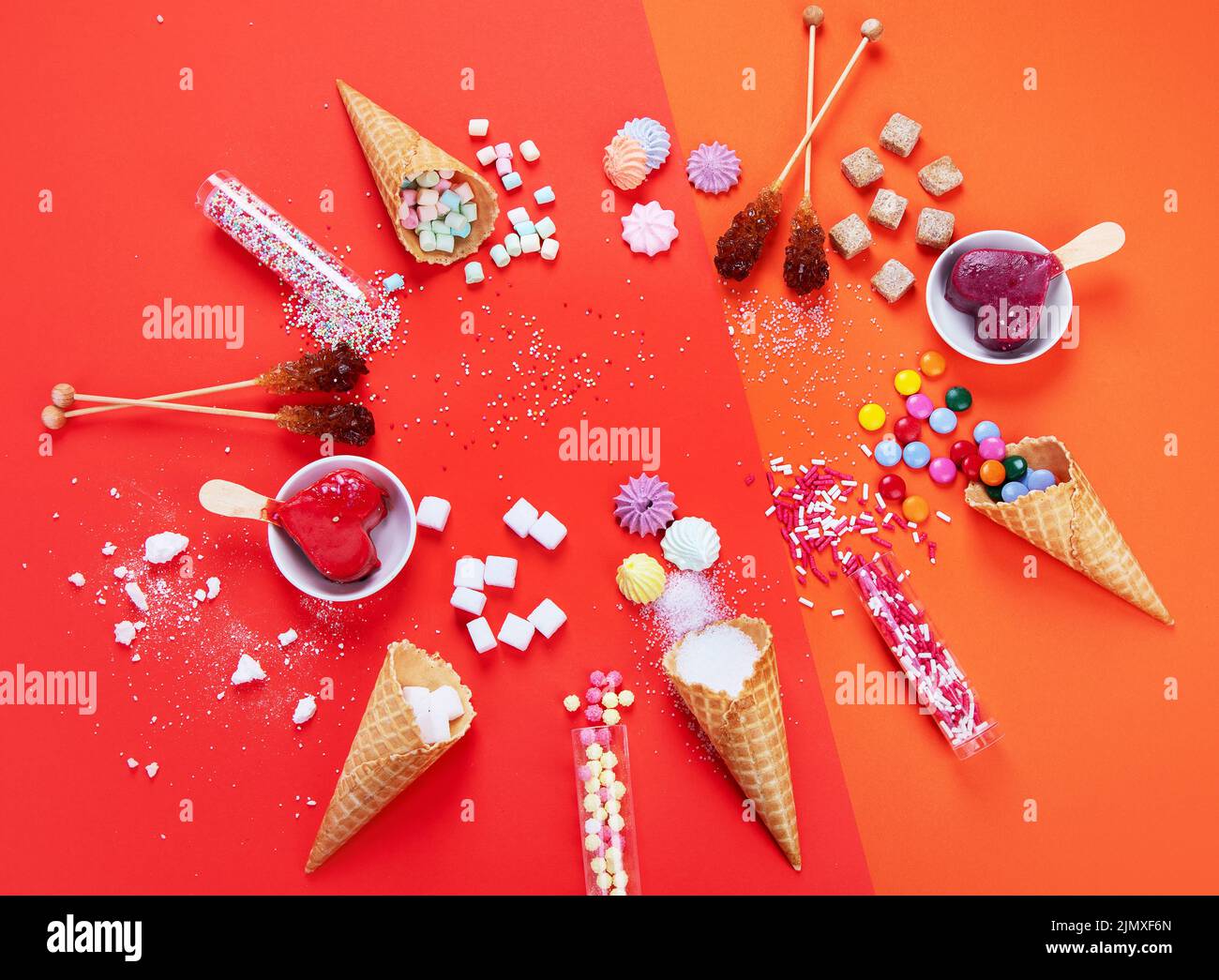 Mix of sweets and candy with sugar spread and written text in unhealthy ...