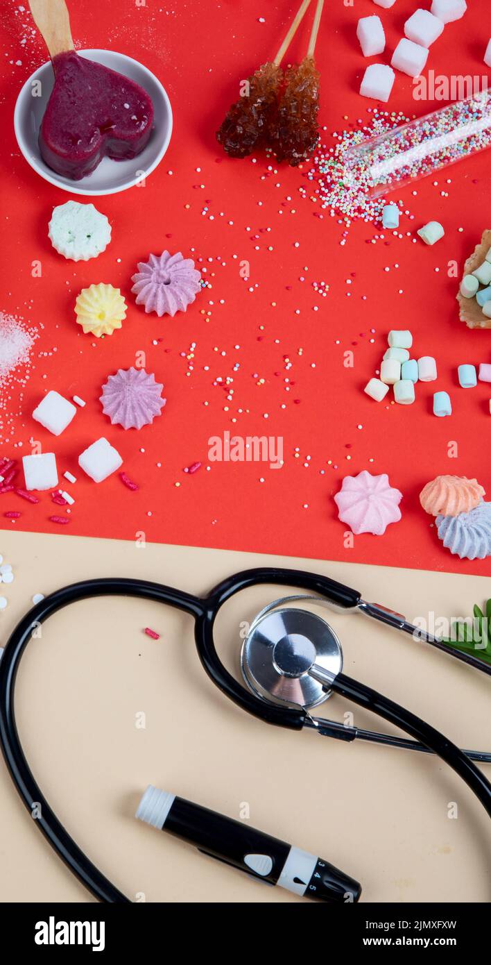 Mix of sweets and candy with sugar spread and written text in unhealthy ...