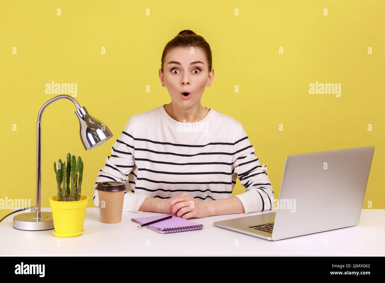 Extremely shocked surprised woman office manager looking at camera with ...