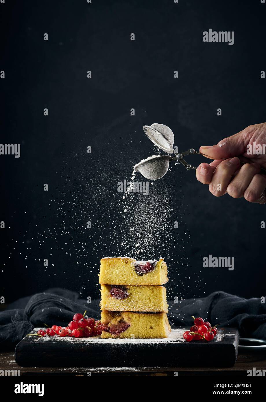 Stack of square slices of baked plum biscuit cake Stock Photo - Alamy