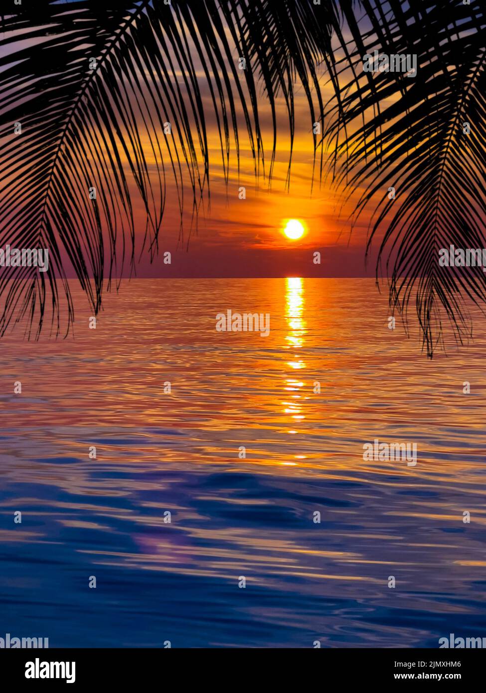 Beautiful sunset at a beach resort in the tropics Stock Photo - Alamy