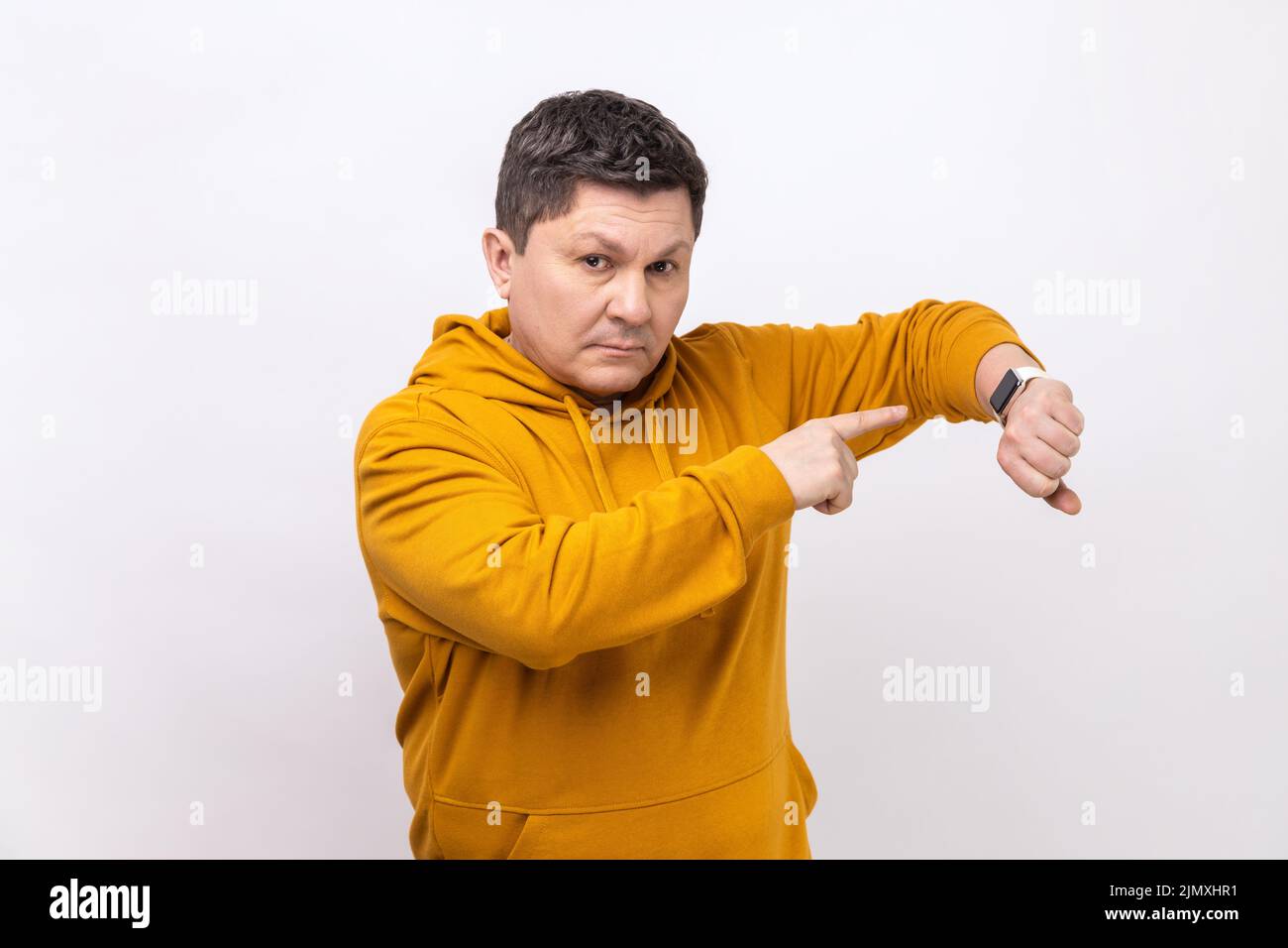 You are late. Portrait of serious bossy man standing, looking at camera ...