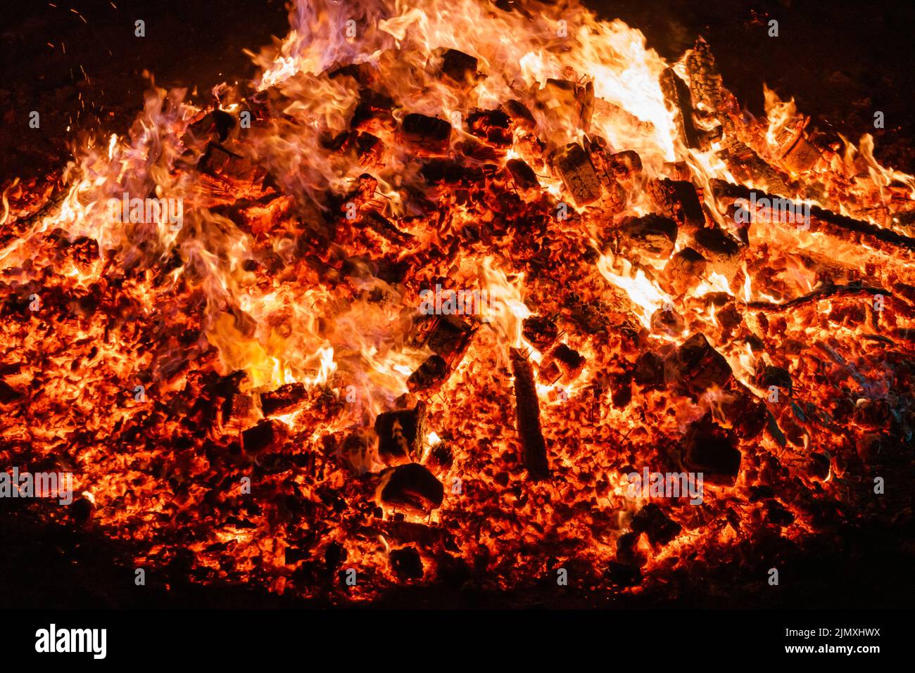 Burning coals from a fire abstract background Stock Photo - Alamy