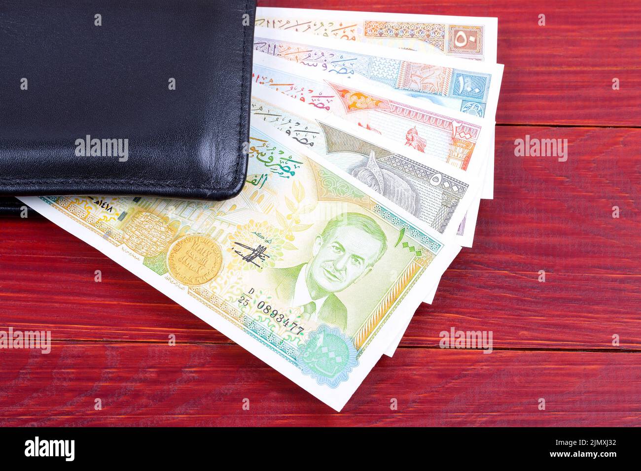 Old Syrian pound in the black wallet Stock Photo - Alamy