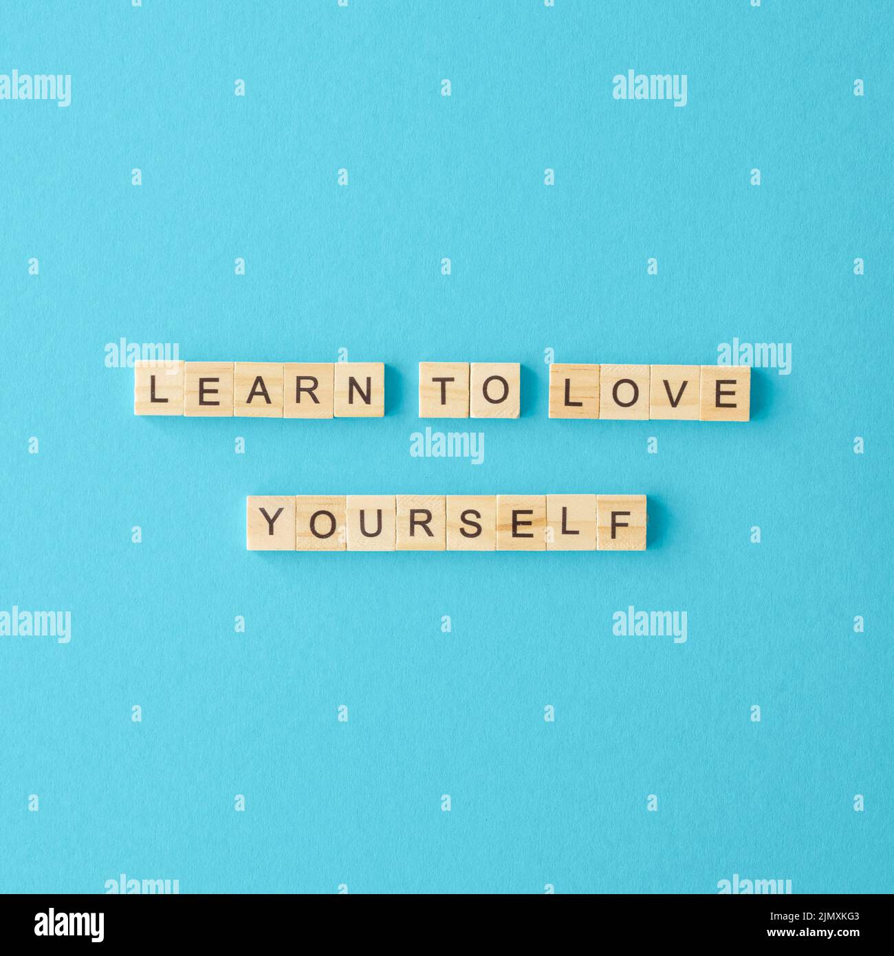 Top view letter cubes blue background Stock Photo - Alamy