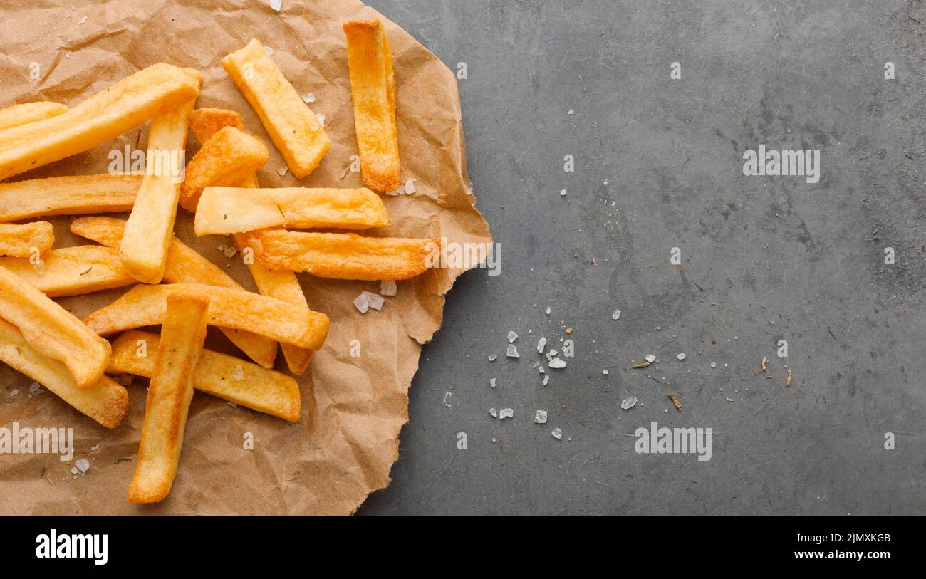 Top view french fries paper with salt copy space Stock Photo - Alamy