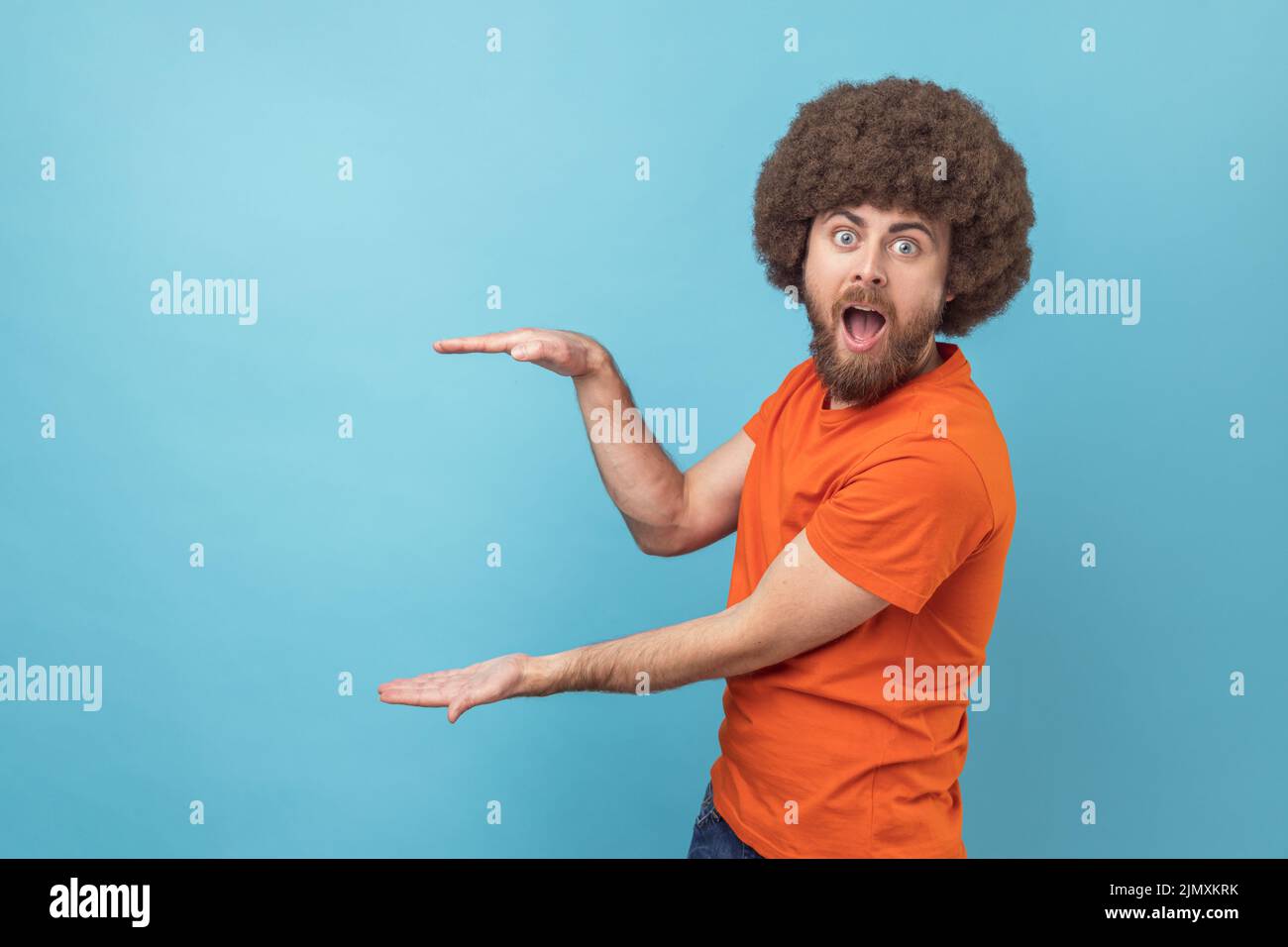 Bearded man afro hairstyle surprised hi-res stock photography and ...