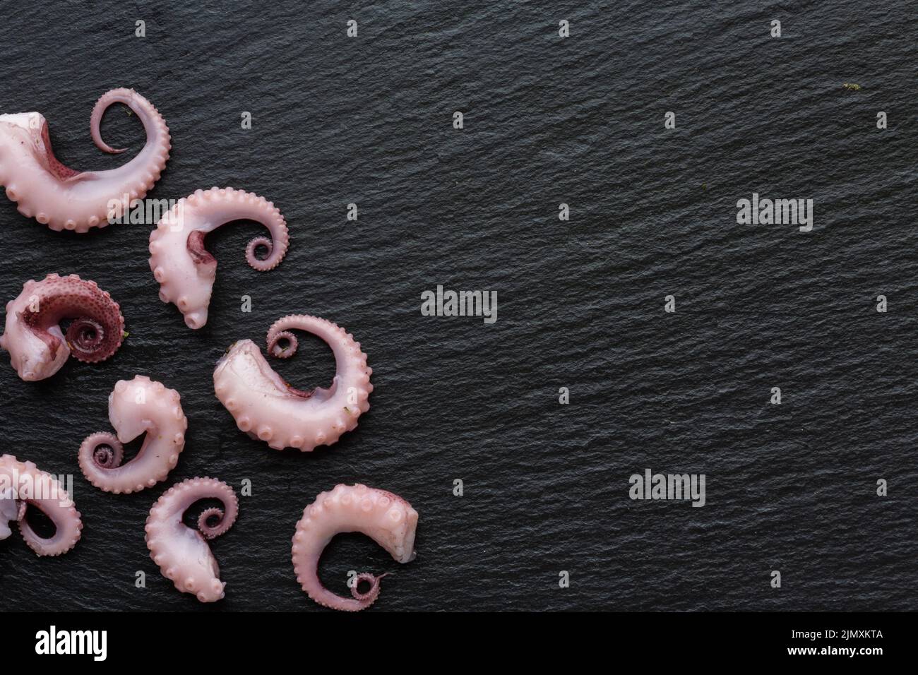 Top view small pieces octopus Stock Photo - Alamy