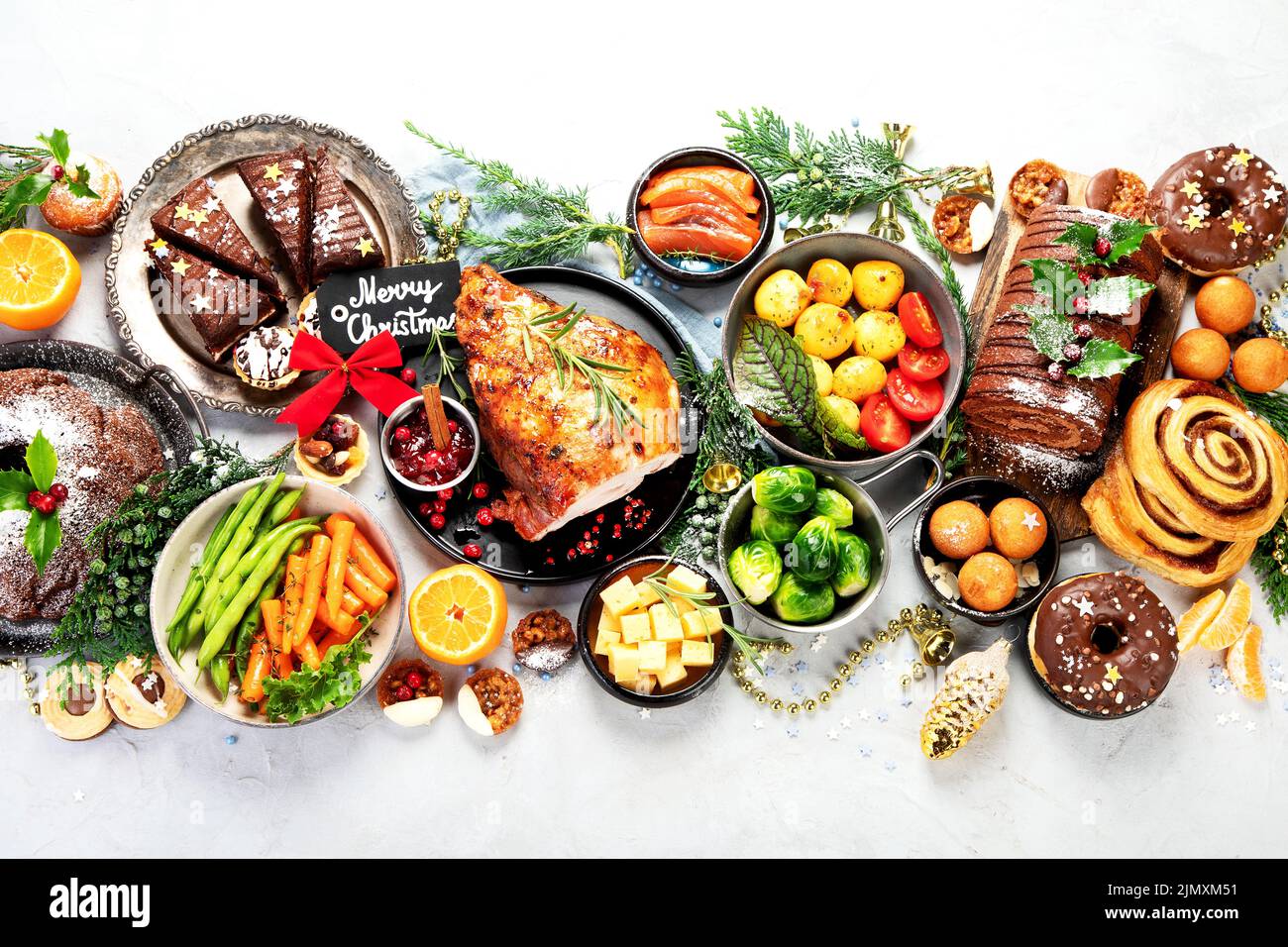 Delicious Christmas themed dinner table with roasted meat, potato ...