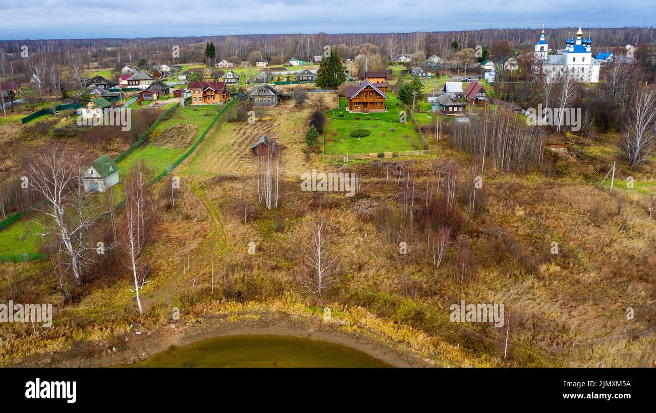 Aerial view of the village on a high hill above the river at sunrise in ...