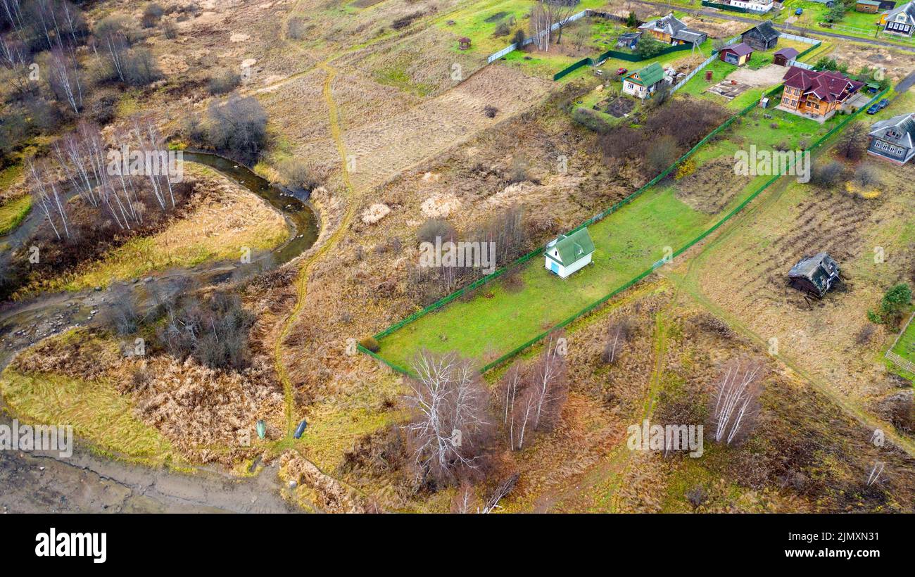 Aerial view of the village on a high hill above the river at sunrise in ...