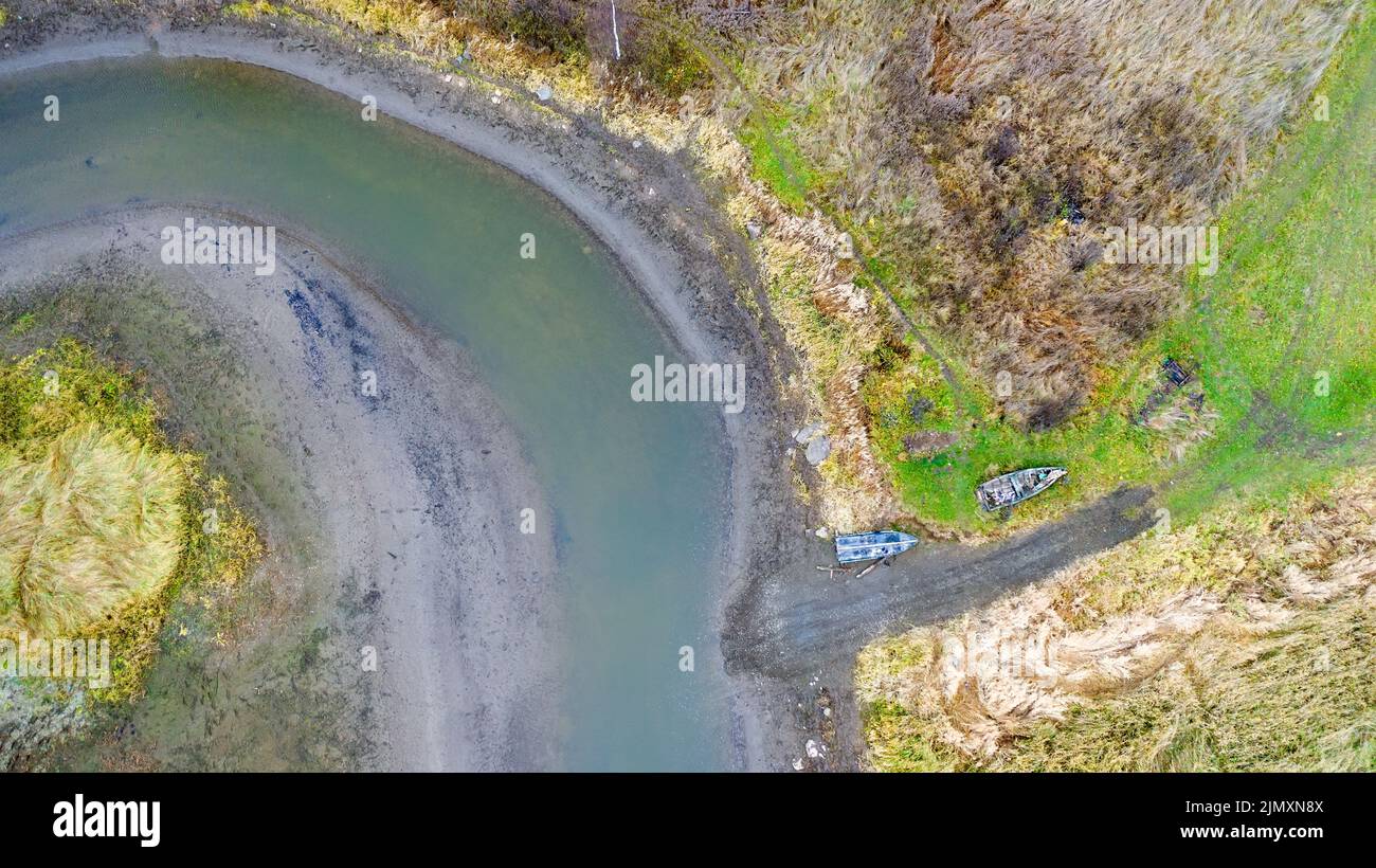 Aerial view of beautiful curving river at sunrise in autumn. View from ...