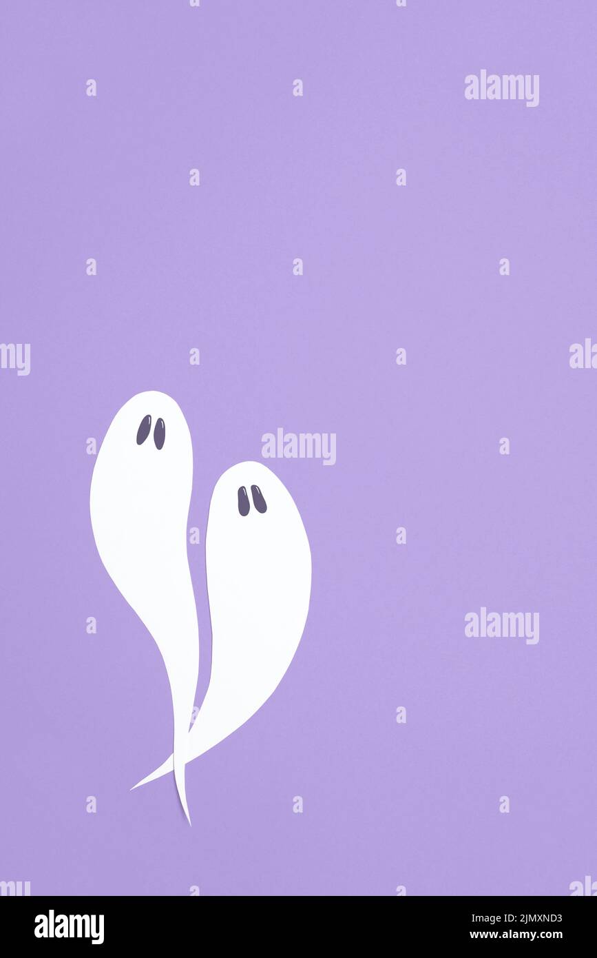Cute minimal halloween composition, couple of white ghosts flying on ...